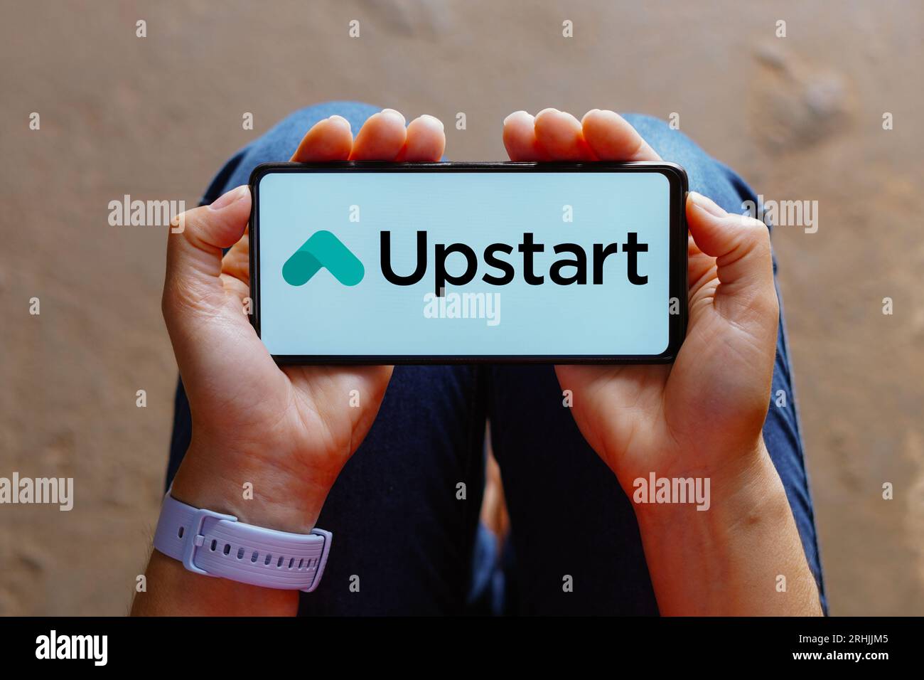 In this photo illustration, the Upstart logo is displayed on a ...