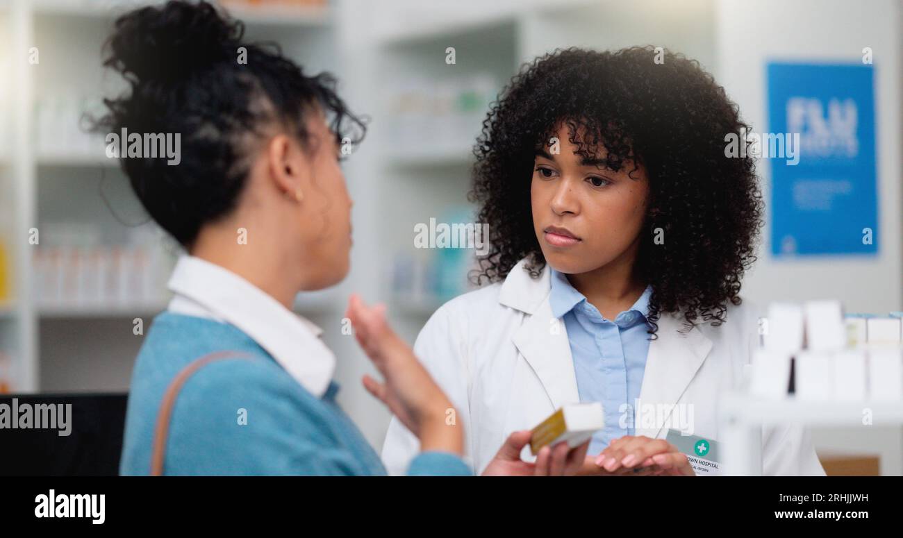 Happy pharmacy woman consultant helping customer with her prescription ...