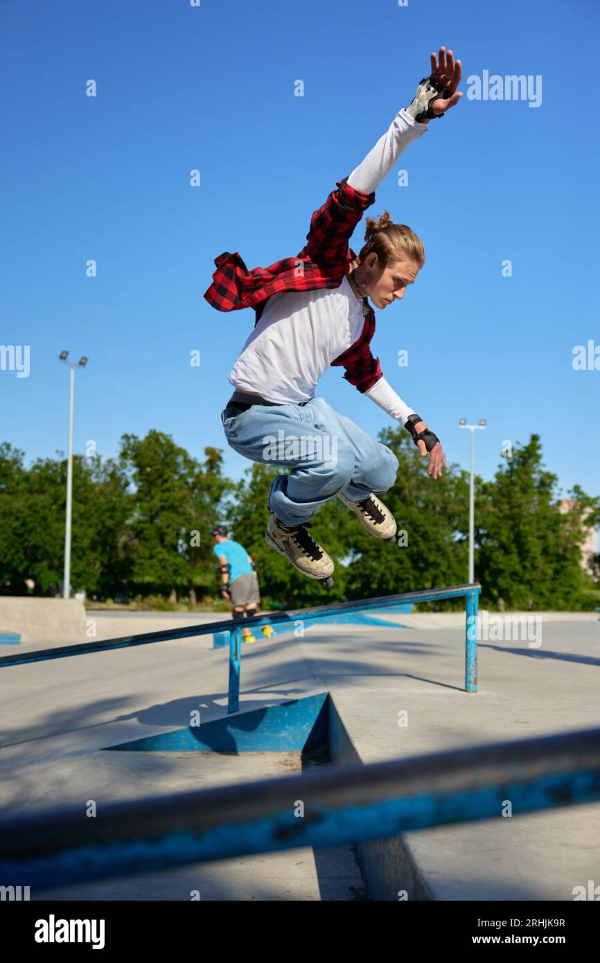 Young boy on roller blades hi-res stock photography and images - Alamy