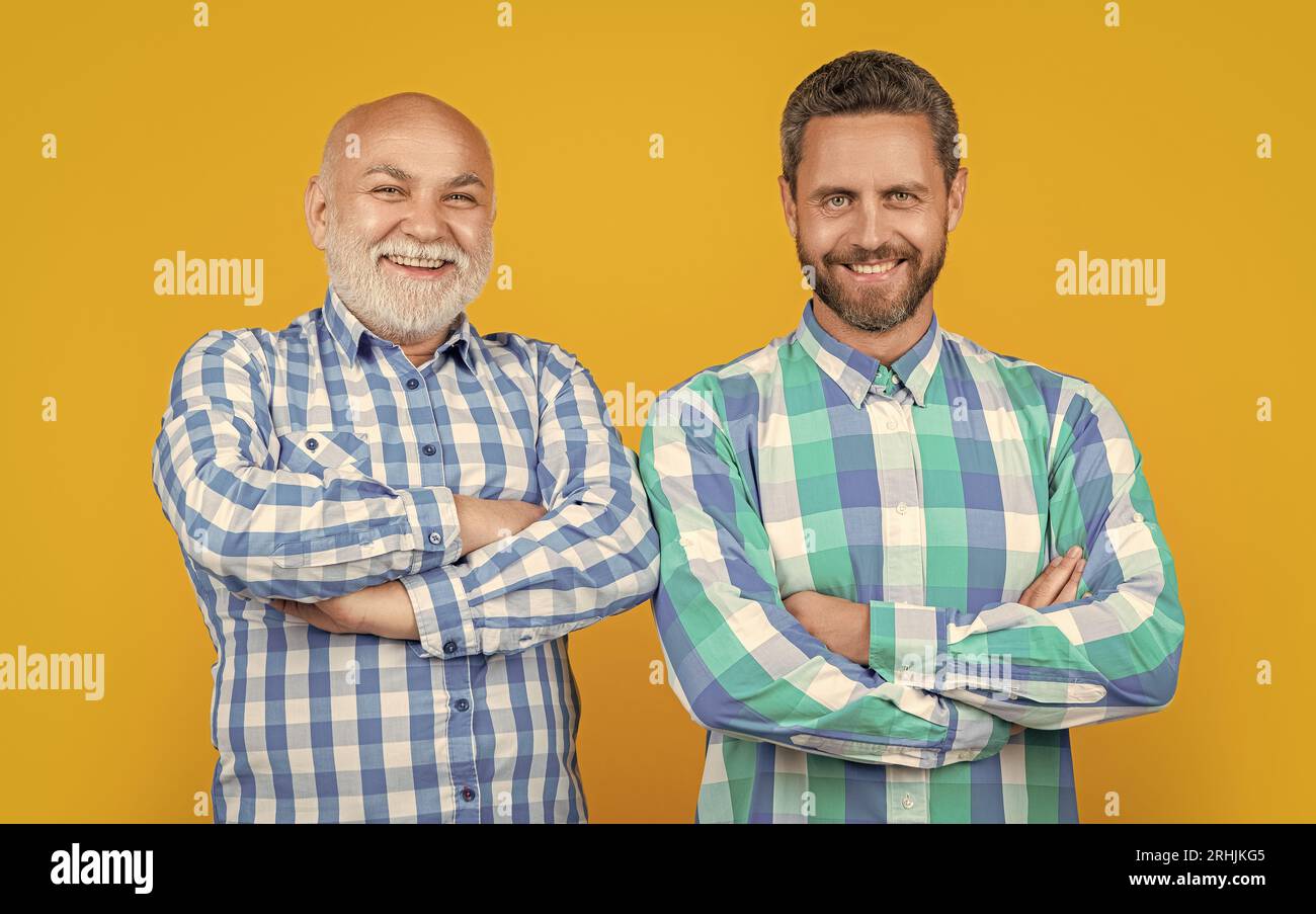 happy two generation family men in studio. two generation family men on ...