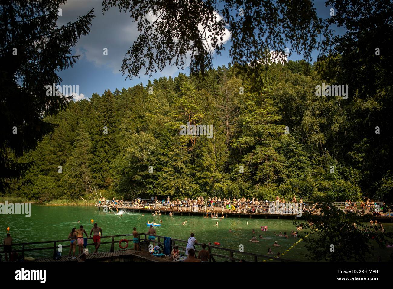 People enjoy the warm weather by a lake near Vilnius, Lithuania ...