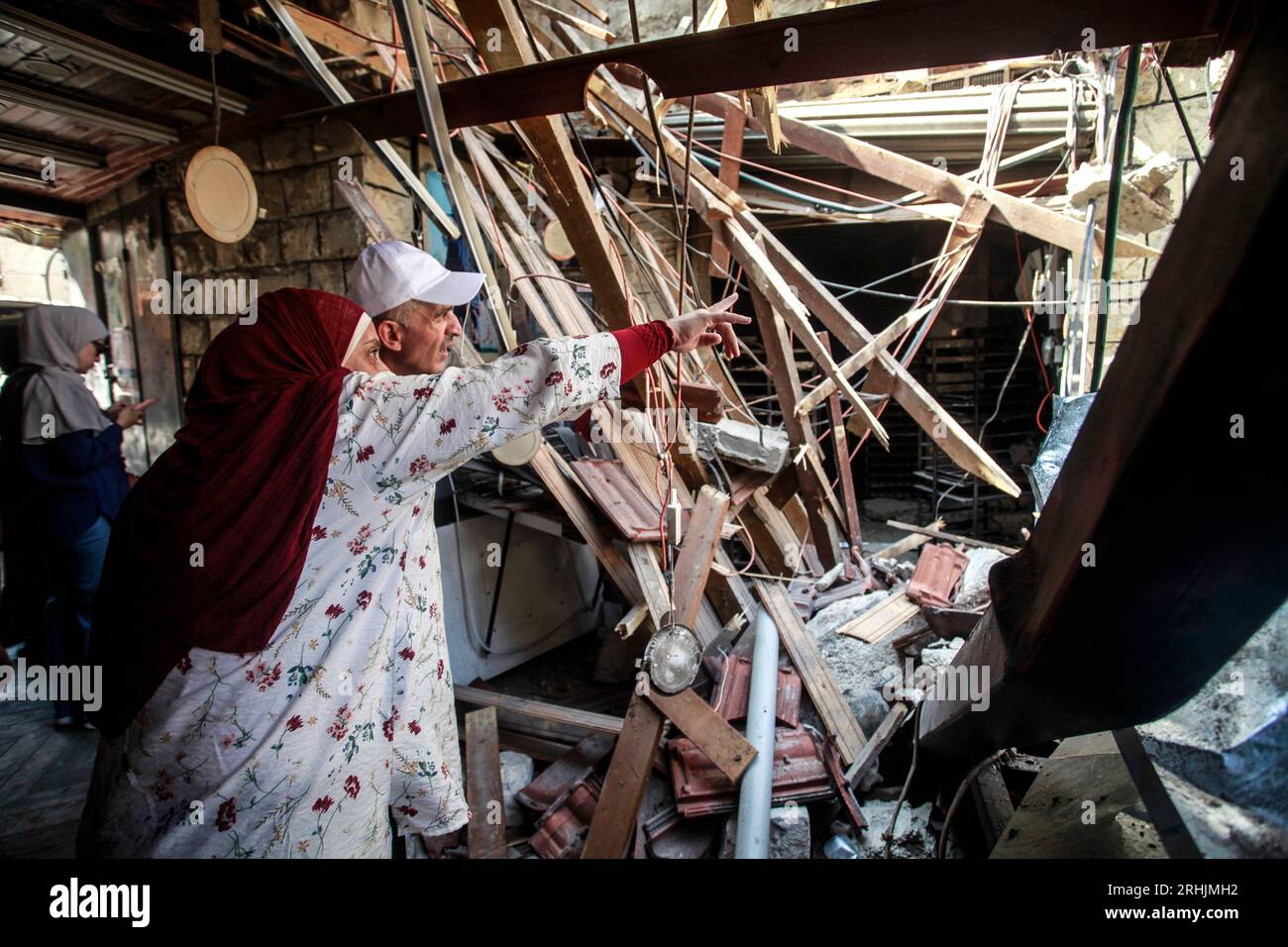 Jenin, Palestine. 17th Aug, 2023. Palestinians inspect the effects of ...
