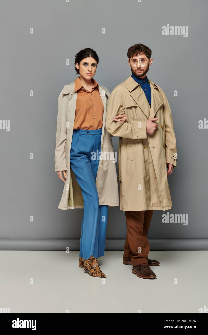 stylish couple in trench coats, fashion shot, man and woman, outerwear ...