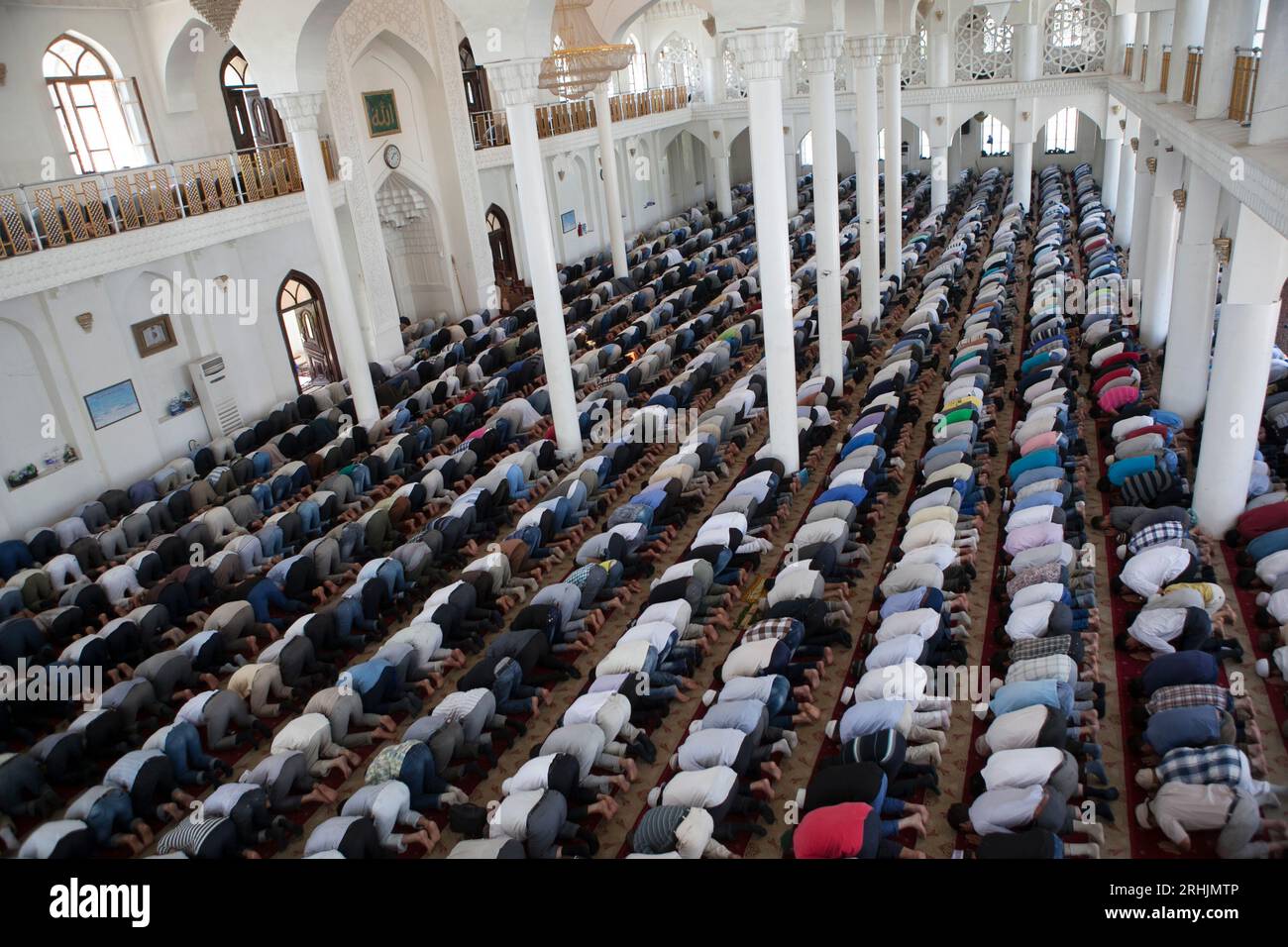 Men pray in the Haji Yaqub Mosque in Dushanbe, Tajikistan Stock Photo ...