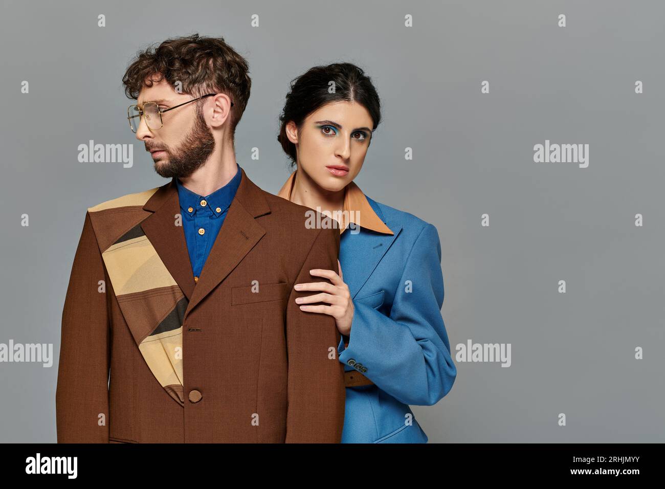 fashion shoot, trendy couple in suits, tailored, stylish formal attire ...