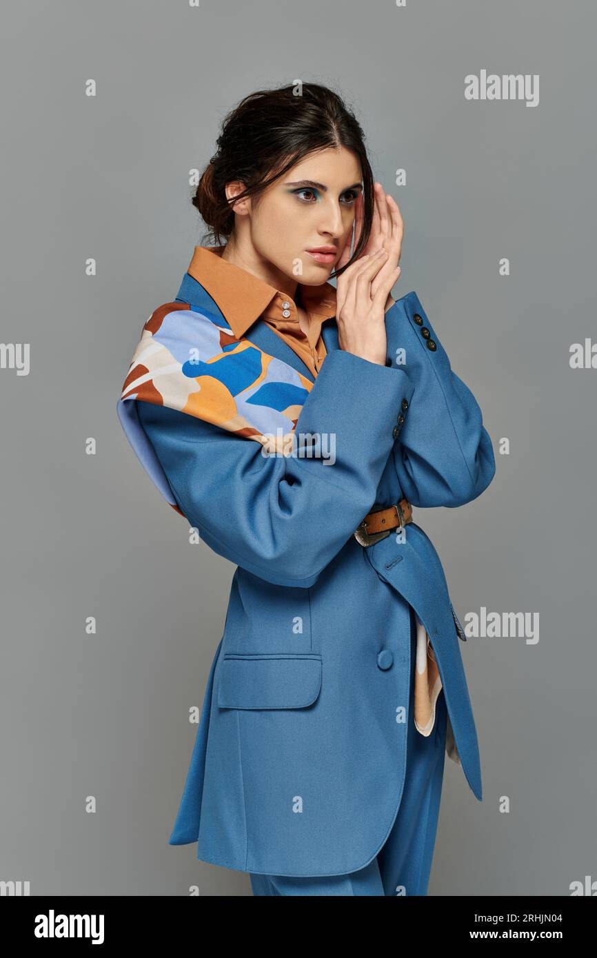 portrait, brunette woman with bold makeup, dreamy, model in blue suit ...