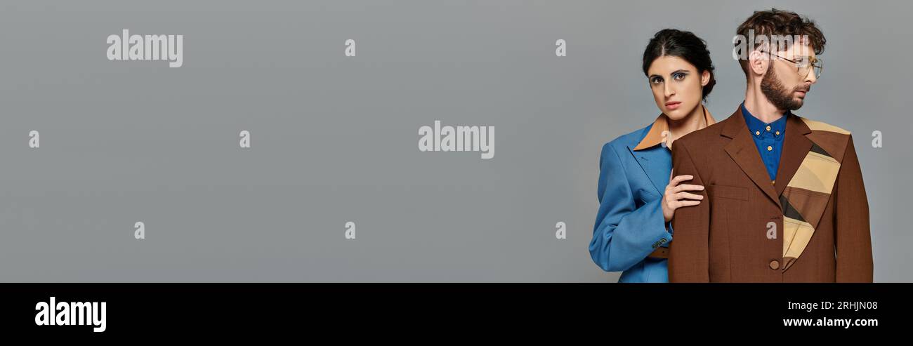 fashion shoot, trendy couple in suits, tailored, stylish formal attire ...