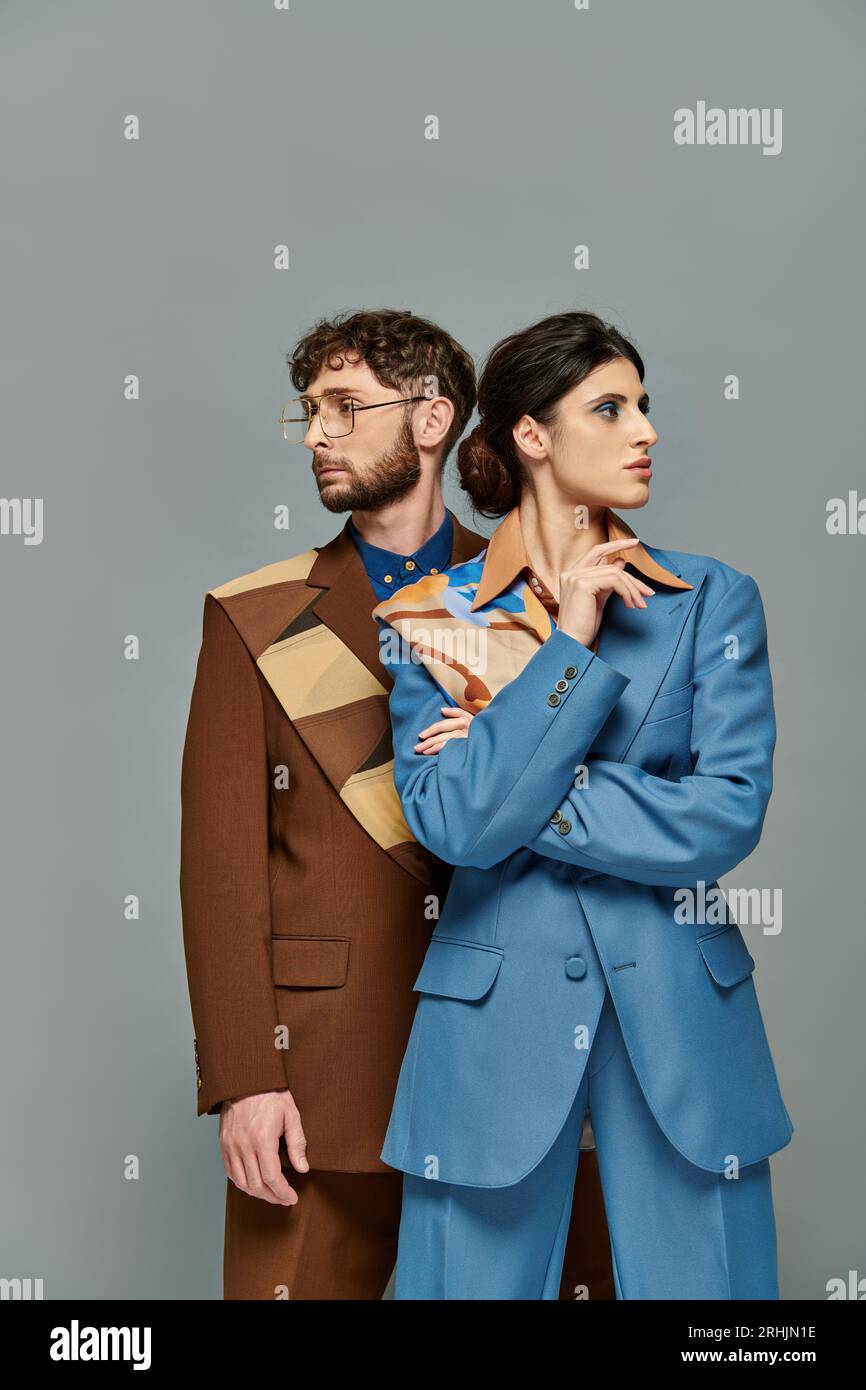 portrait of man in glasses and woman looking at different directions ...