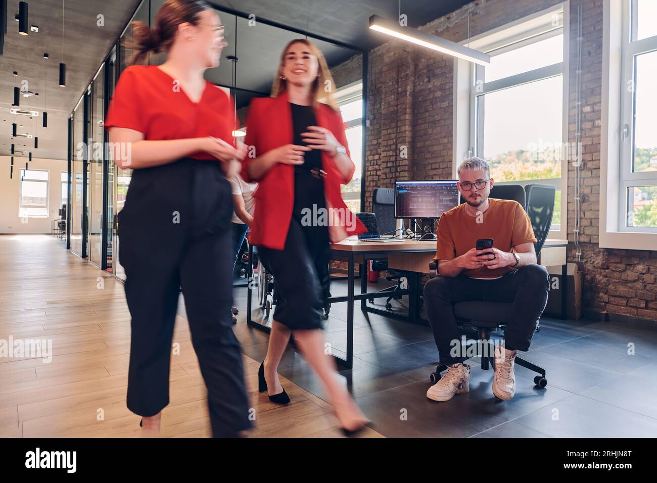 A diverse group of business professionals collaborates in a modern ...