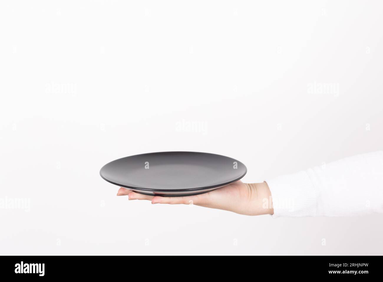 Female hand hold plate hi-res stock photography and images - Alamy