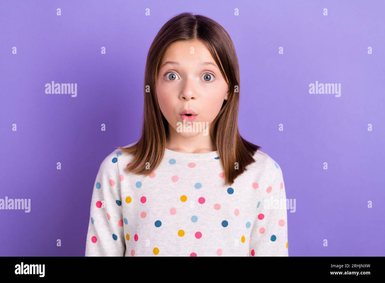 Portrait of impressed speechless schoolkid pouted lips staring ...