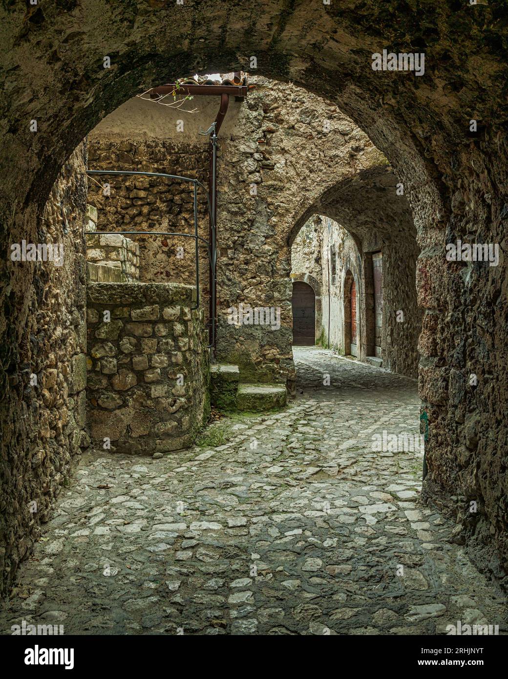 Arches and stone houses, covered walkways and cobbled streets in the ...