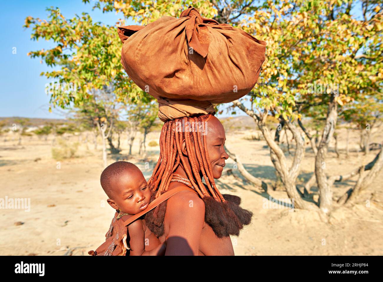 Namibia. Portrait of a Himba woman with her baby, in Kunene region ...