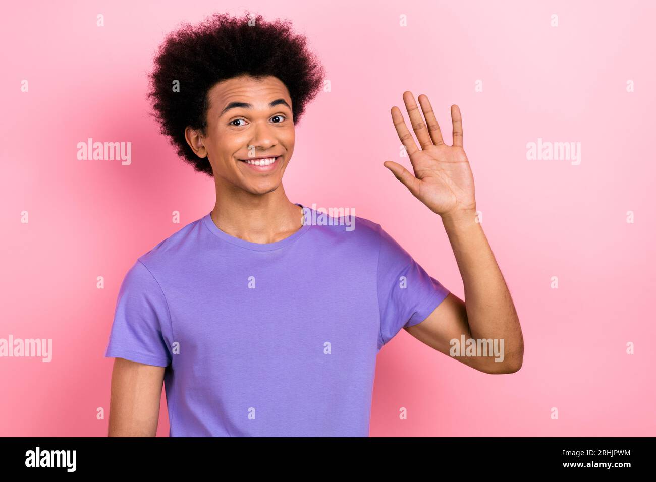 Photo of positive friendly glad man wear violet clothes waving hand ...