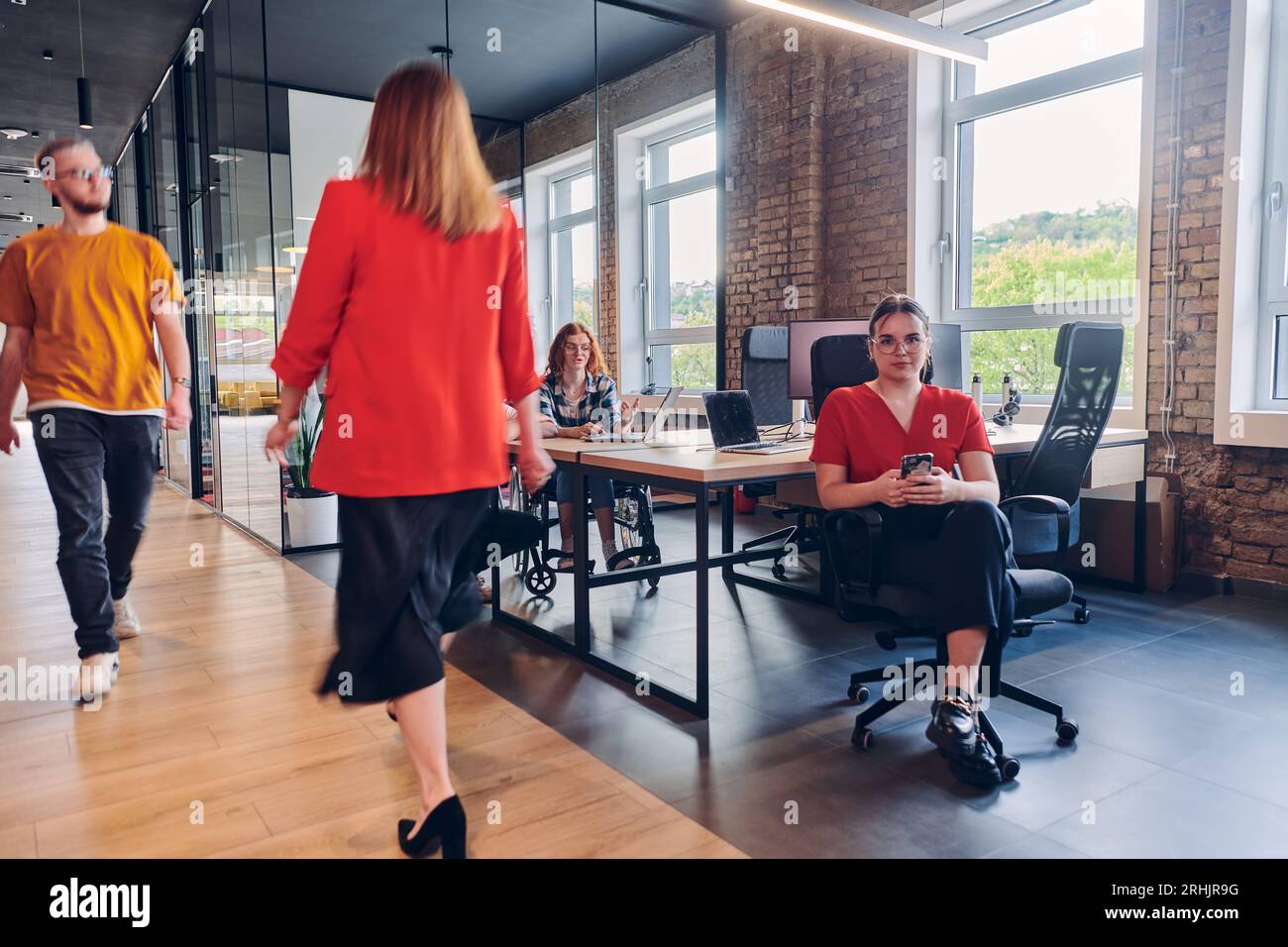 A diverse group of business professionals collaborates in a modern ...