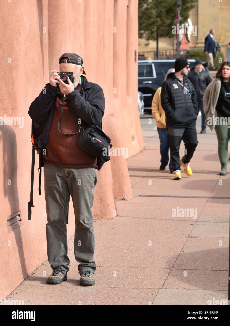 A photographer takes photographs with a Leica camera in downtown Santa ...