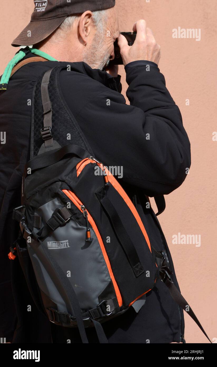 A photographer takes photographs with a Leica camera in downtown Santa ...
