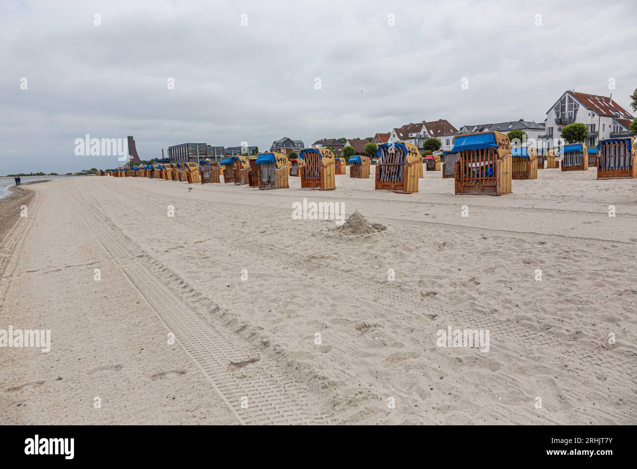 Roofed wicker beach chairs at beach of German village Laboe Stock Photo ...