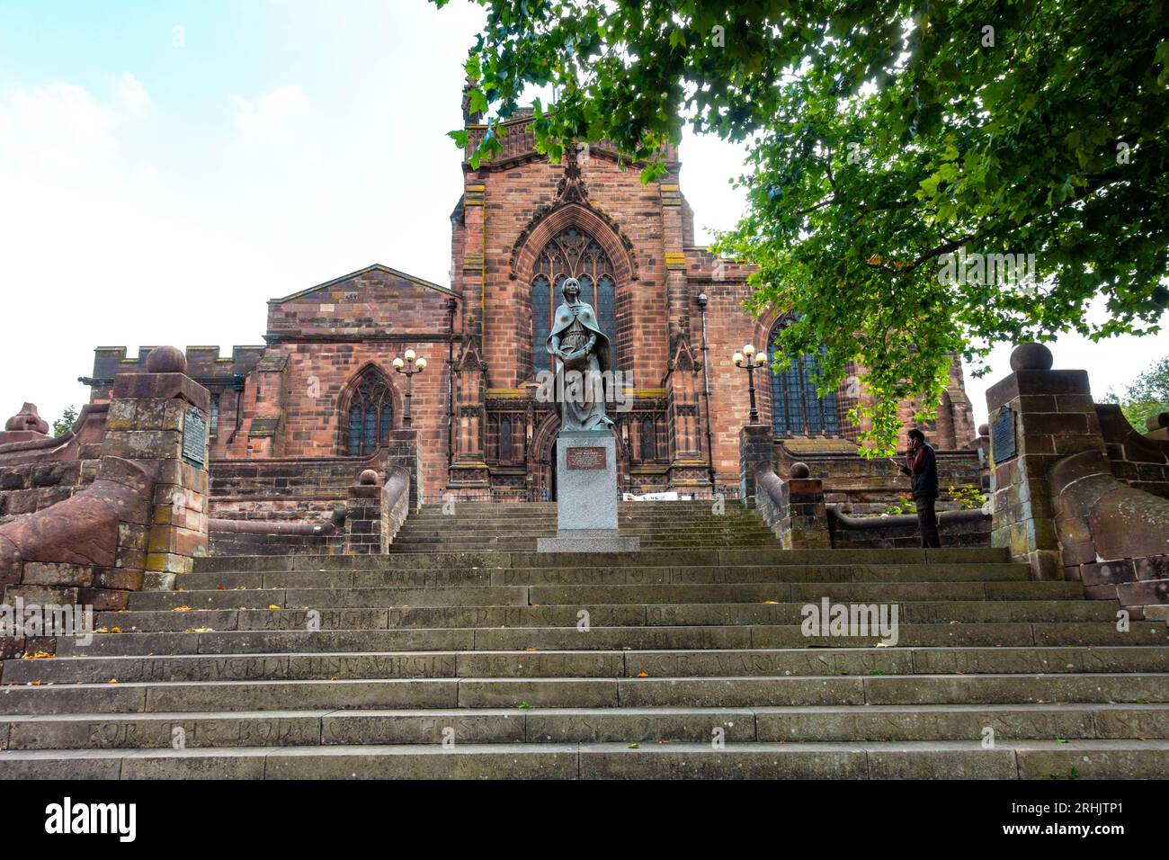 Bronze sculpture of Lady Wulfrun stands at the top of a stone staircase ...