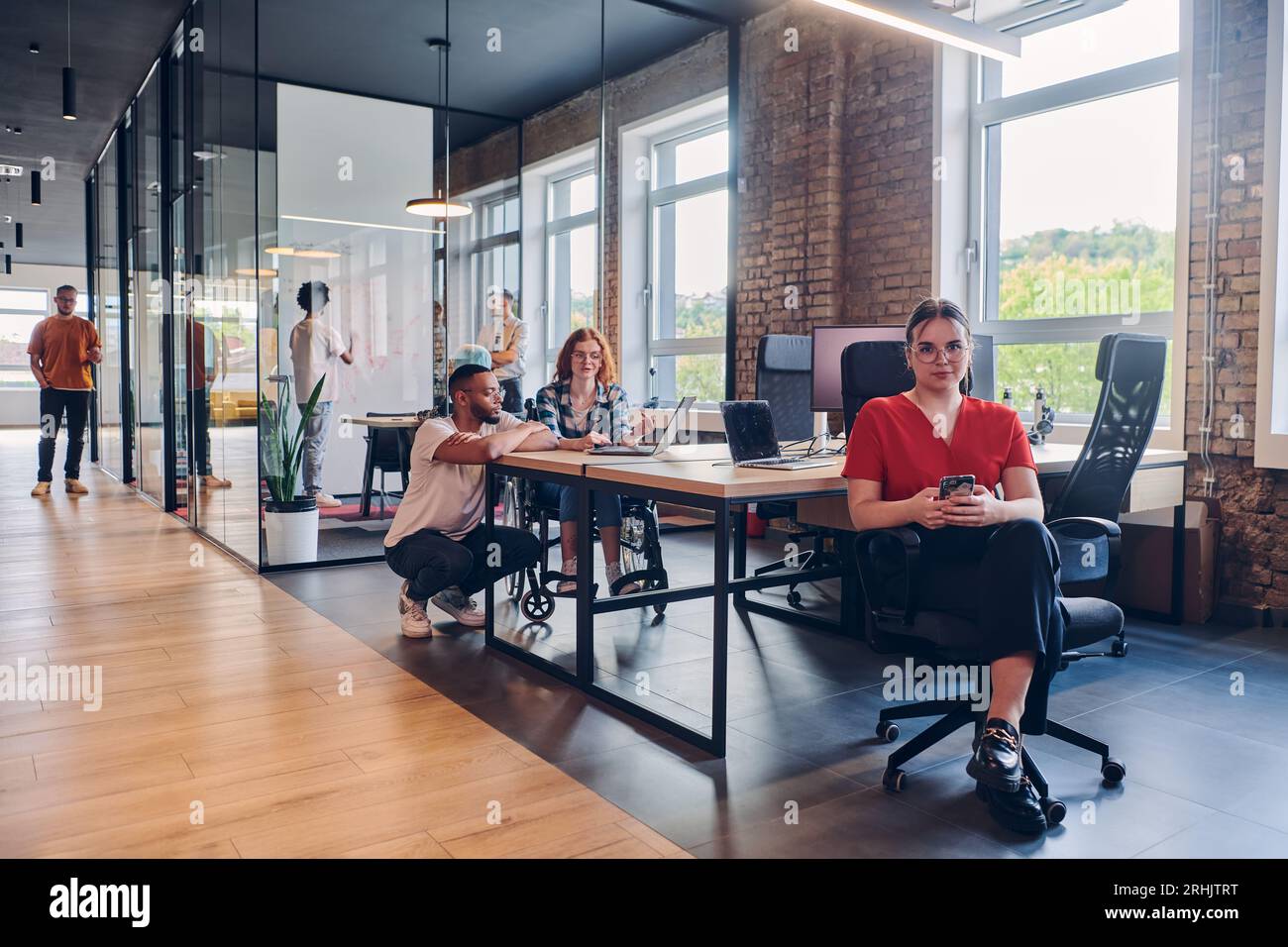 A diverse group of business professionals collaborates in a modern ...