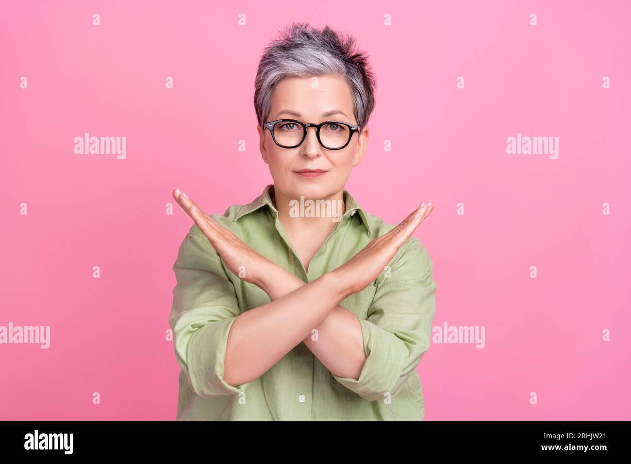 Photo of serious confident mature age businesswoman crossed arms ...