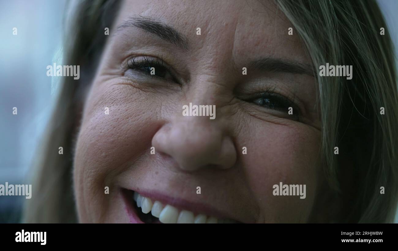Macro close-up of a happy mature woman smiling at camera, a female ...