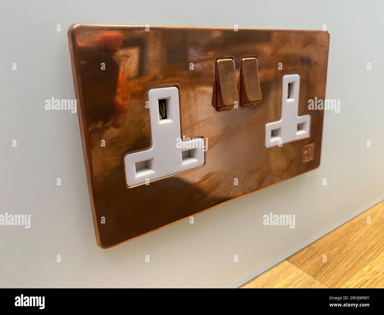 Bronze coloured double plug socket Stock Photo - Alamy