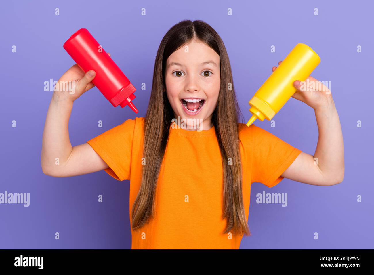 Photo of funky little kid girl holding two sauces cooking show advert ...