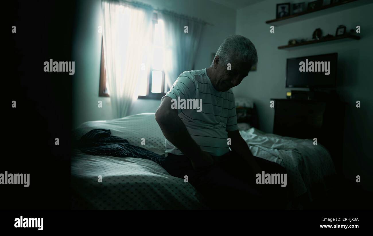 Gloomy Bedroom Scene of Depressed Senior Man, Elderly Person Alone in ...
