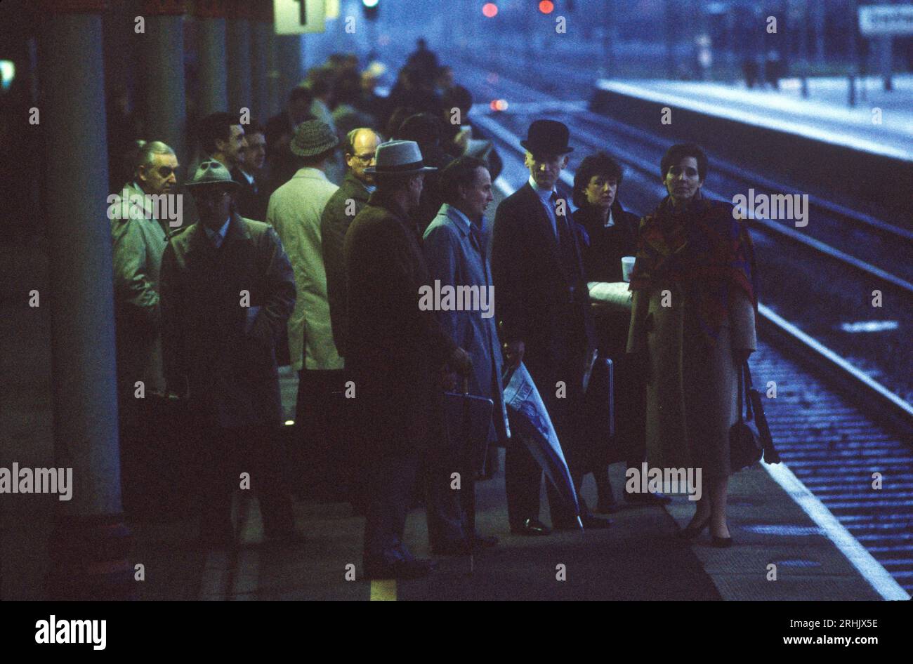 Train Commuters early morning, dusk, waiting for a train at Grantham ...