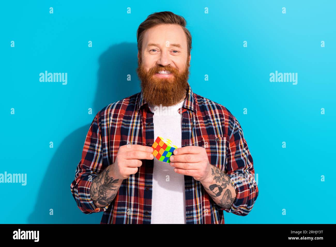 Happy businessman holding rubik cube hi-res stock photography and ...