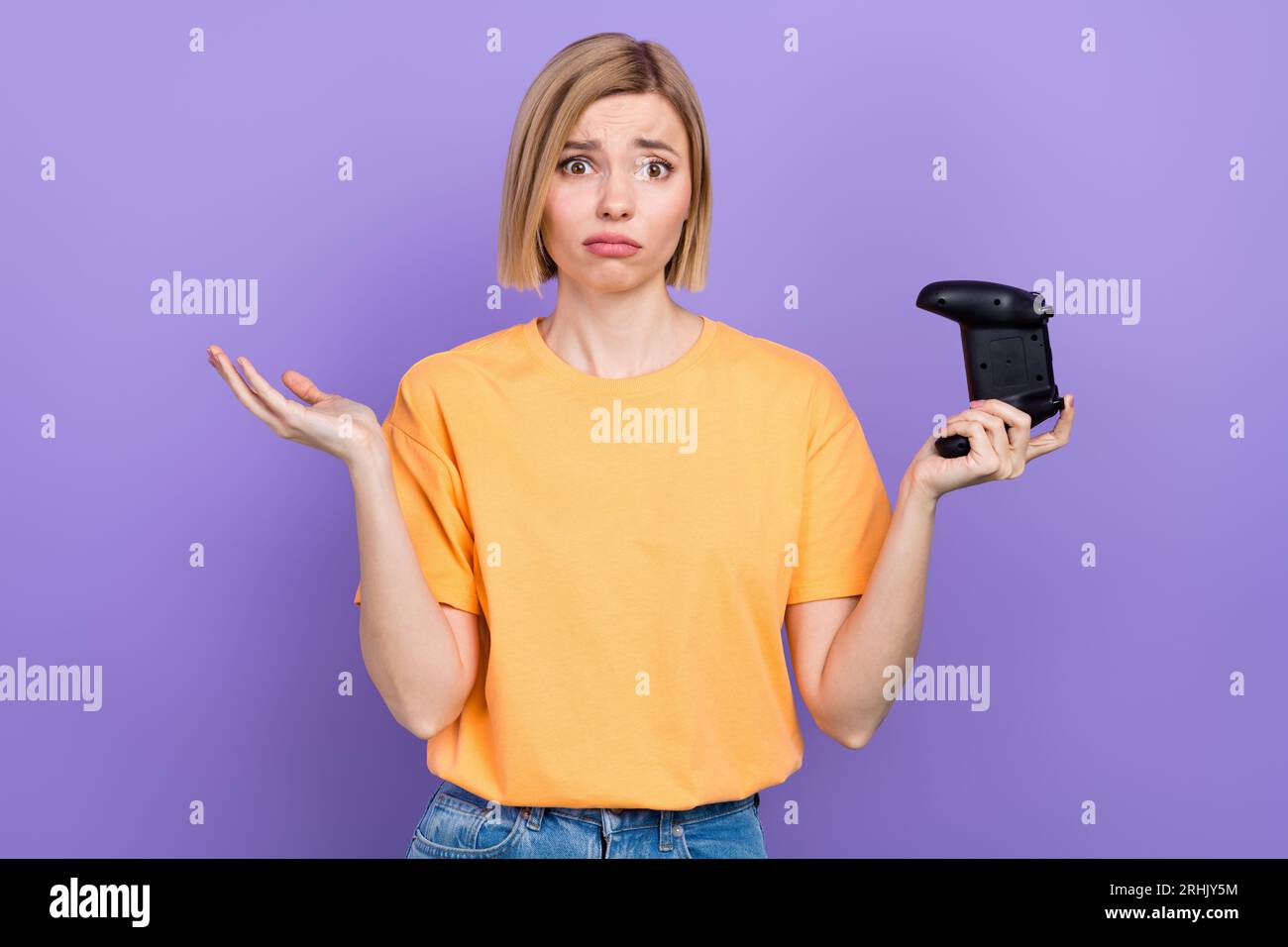 Photo of stupor young woman shrug shoulders yellow t shirt no idea how ...