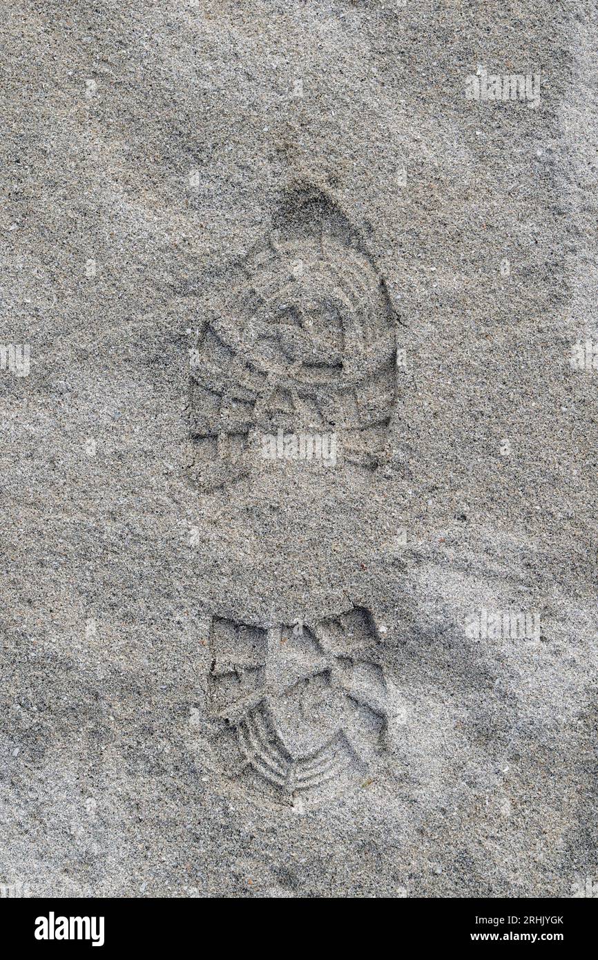 Boot print made by the left foot of a size 9 walking boot in the sand ...