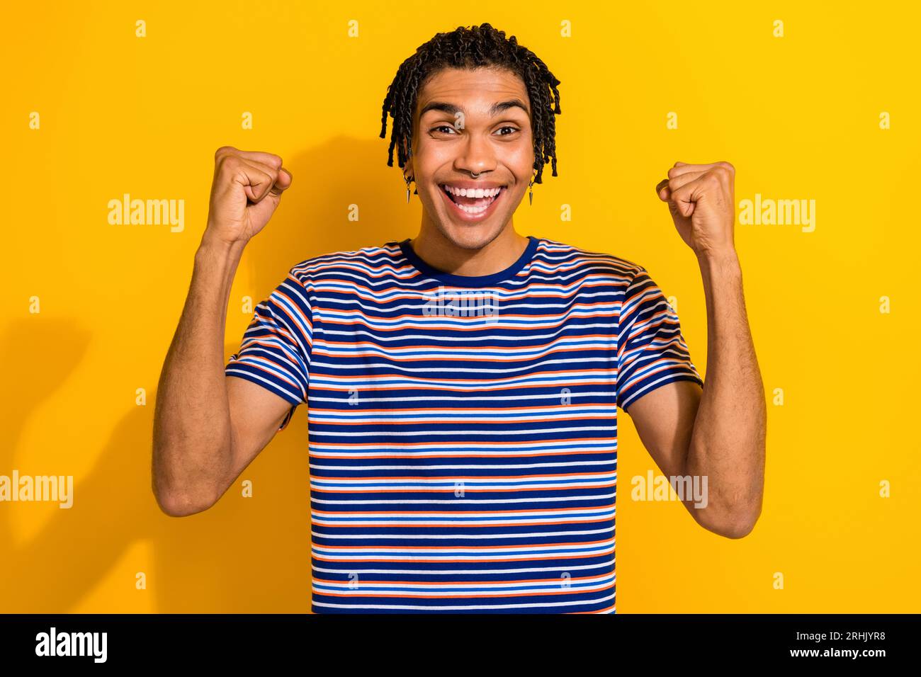 Photo of delighted funky person raise fists luck accomplishment shout ...