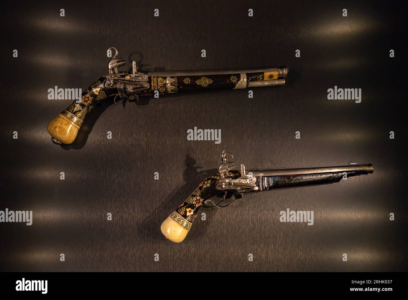 A picture of two pistols inside the Weapon and Armours room, part of ...