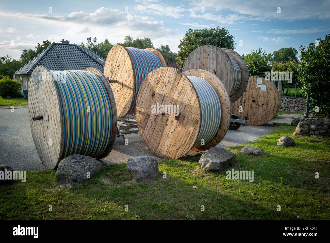 large reels with fiber optic cables stand on a square Stock Photo - Alamy