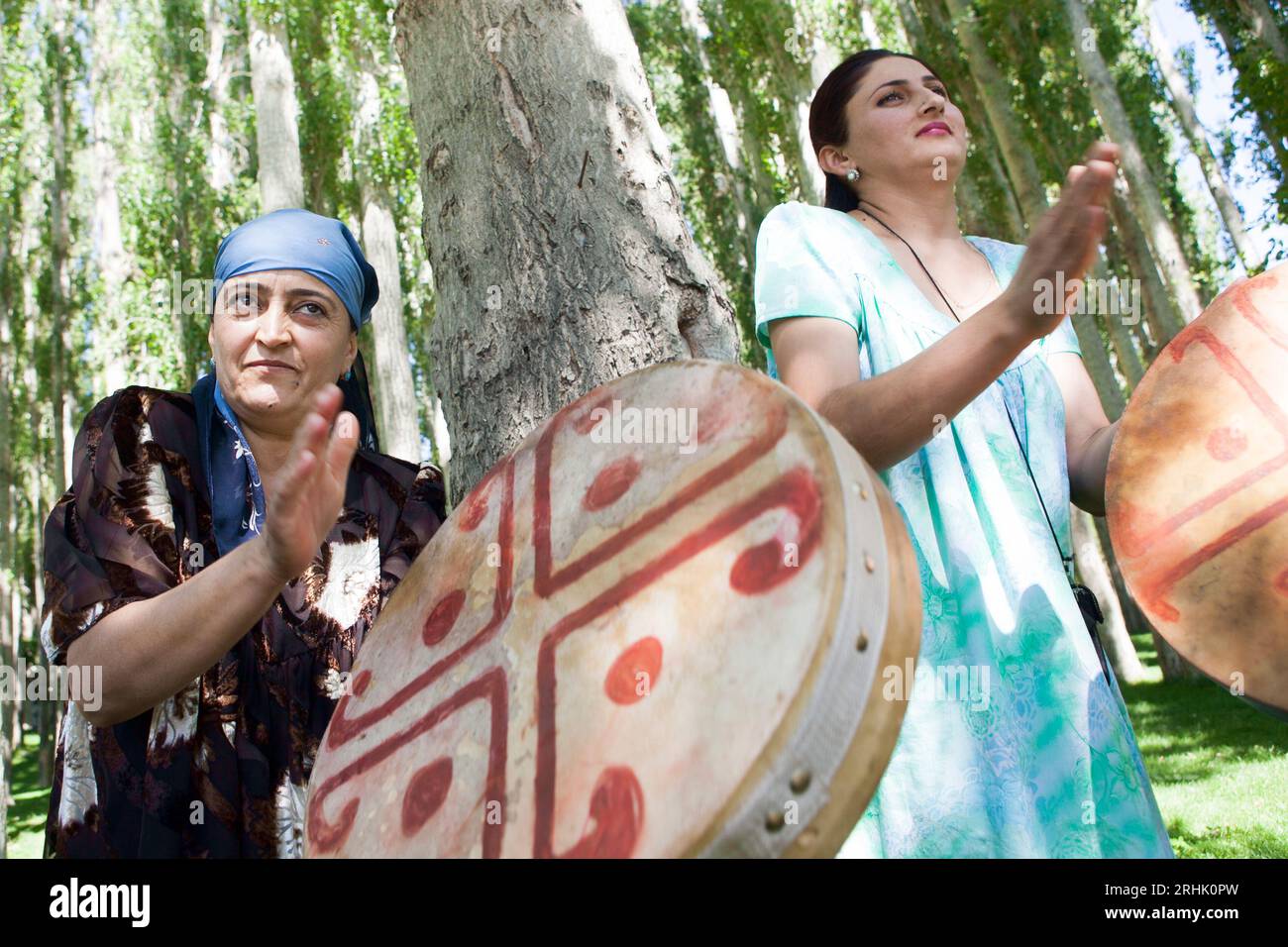 Women play traditional Pamiri drums in Khorogh, Tajikistan Stock Photo - Alamy