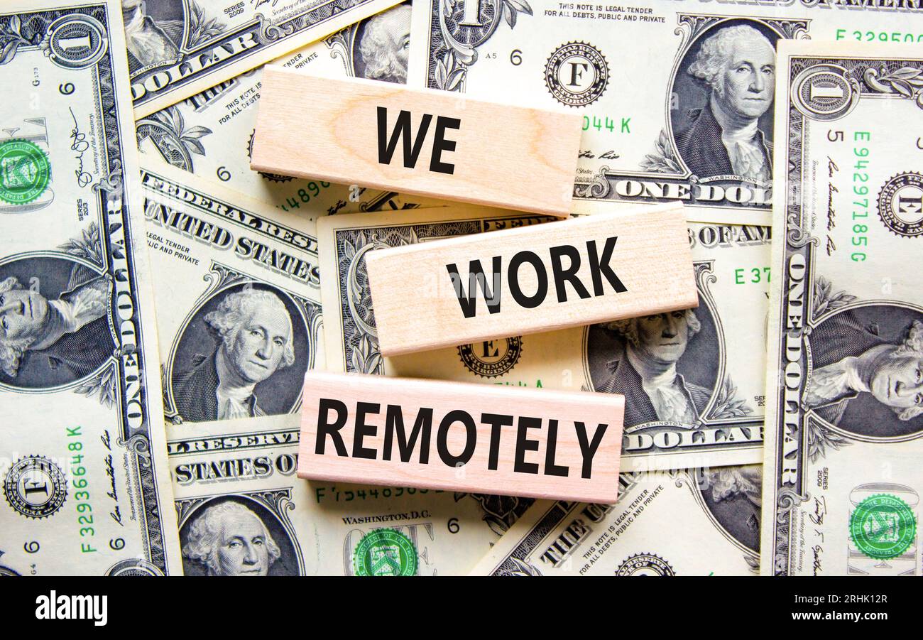 We work remotely symbol. Concept words We work remotely on wooden block ...