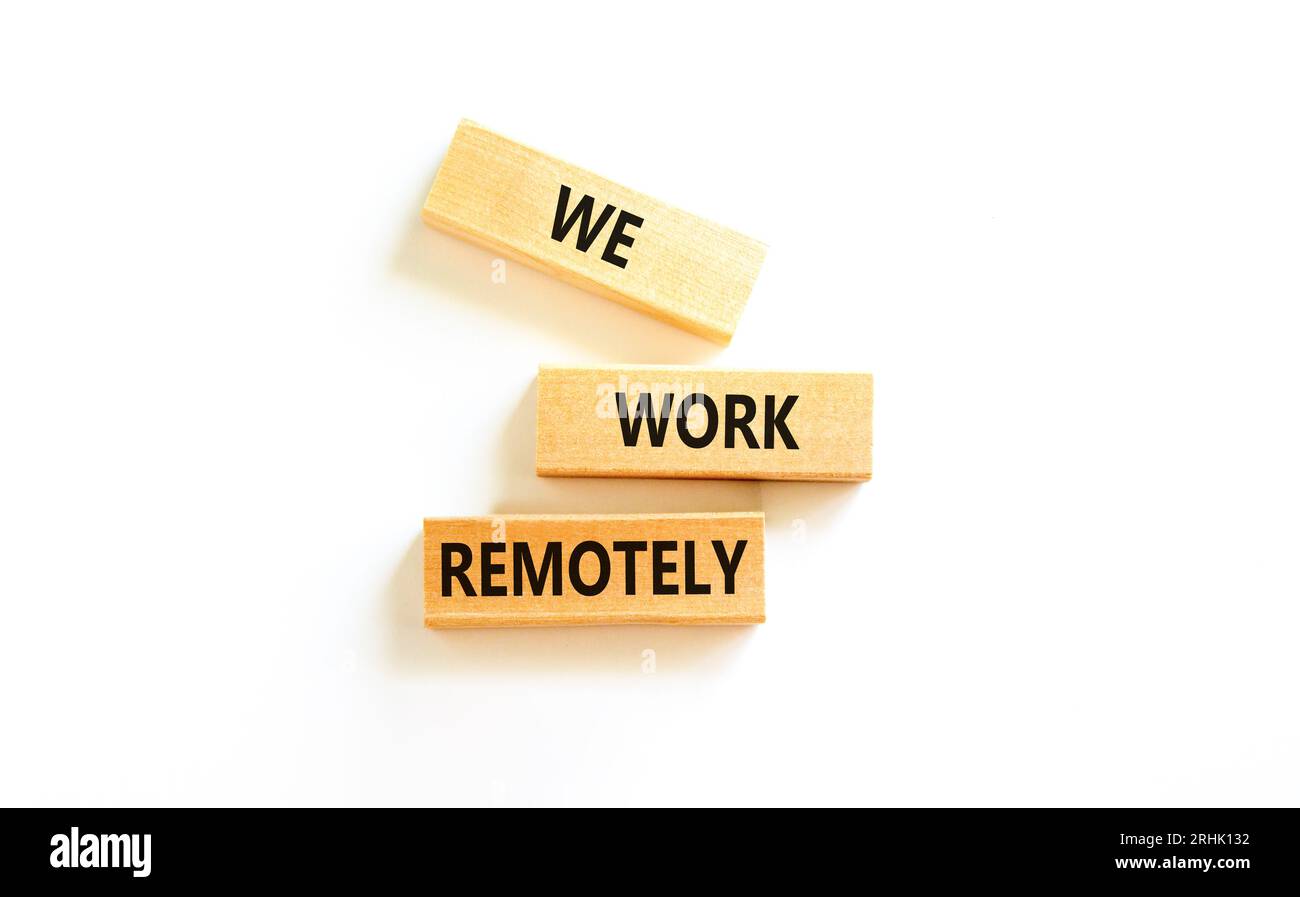 We work remotely symbol. Concept words We work remotely on wooden block ...