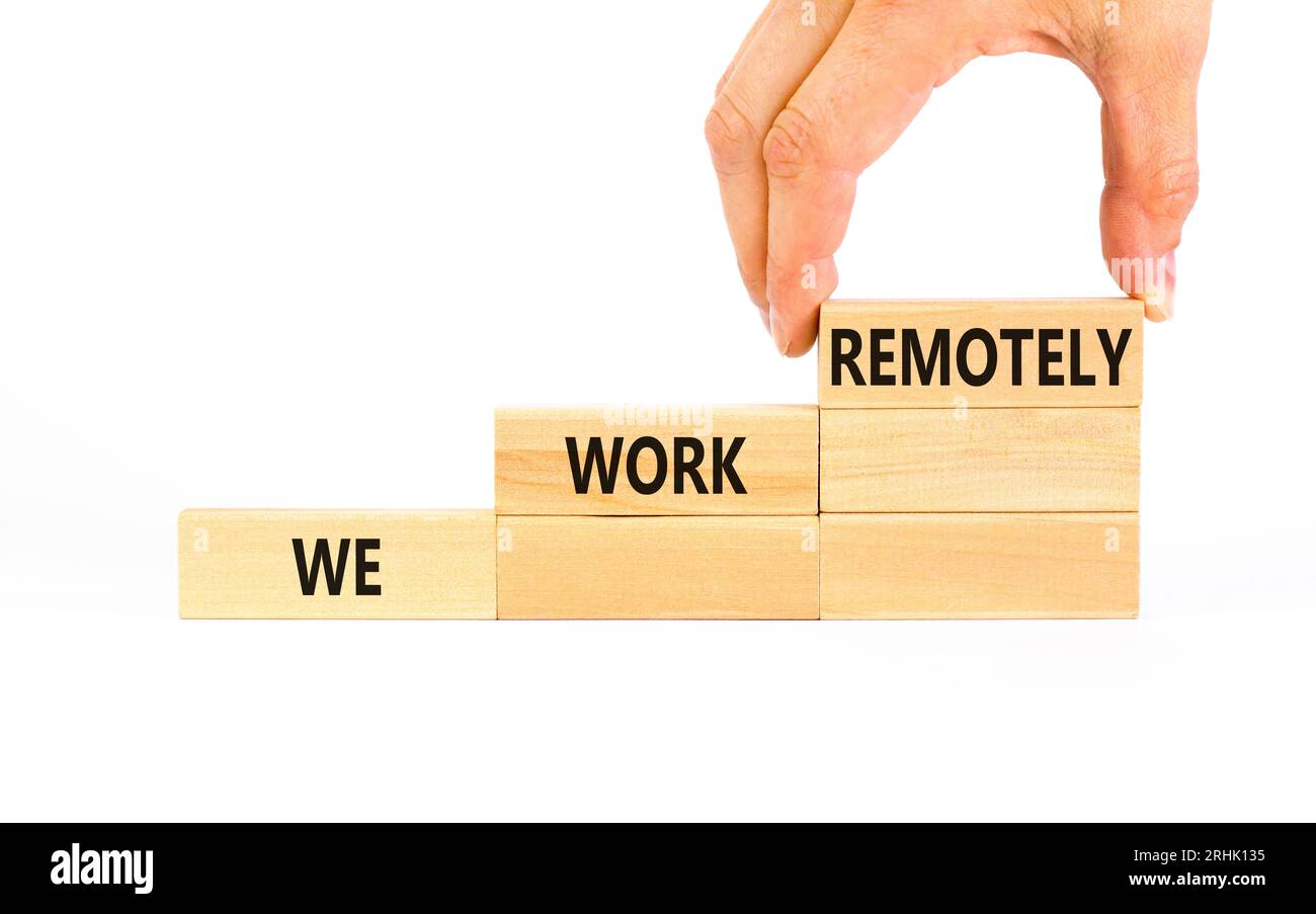 We work remotely symbol. Concept words We work remotely on wooden block ...