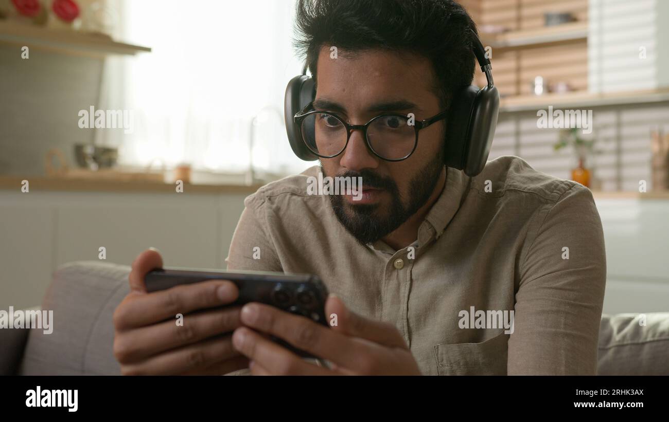 Disappointed Arabian Indian man guy watching sport game streaming on ...