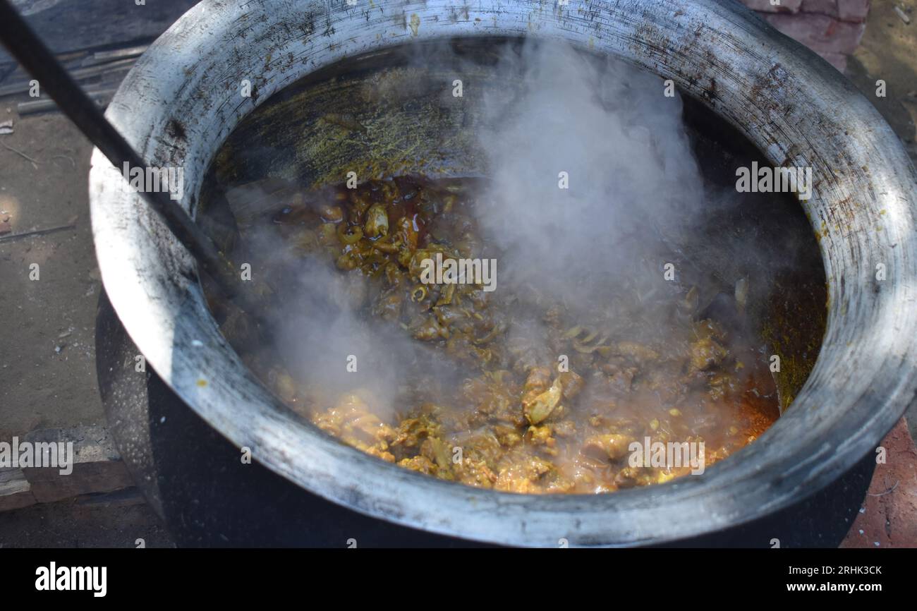 People cooking at the Balukhali refugee camp. Approximately 919,000 ...