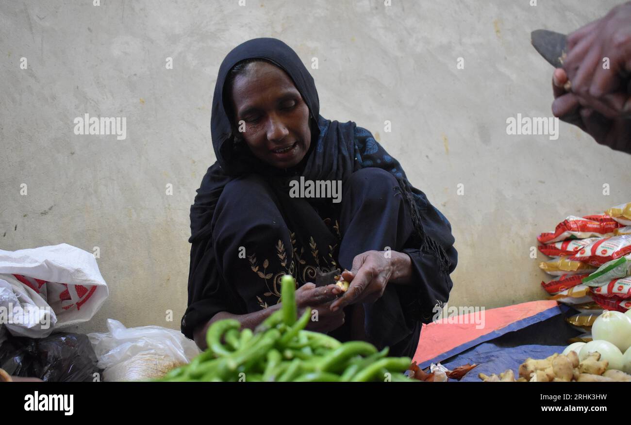 People cooking at the Balukhali refugee camp. Approximately 919,000 ...