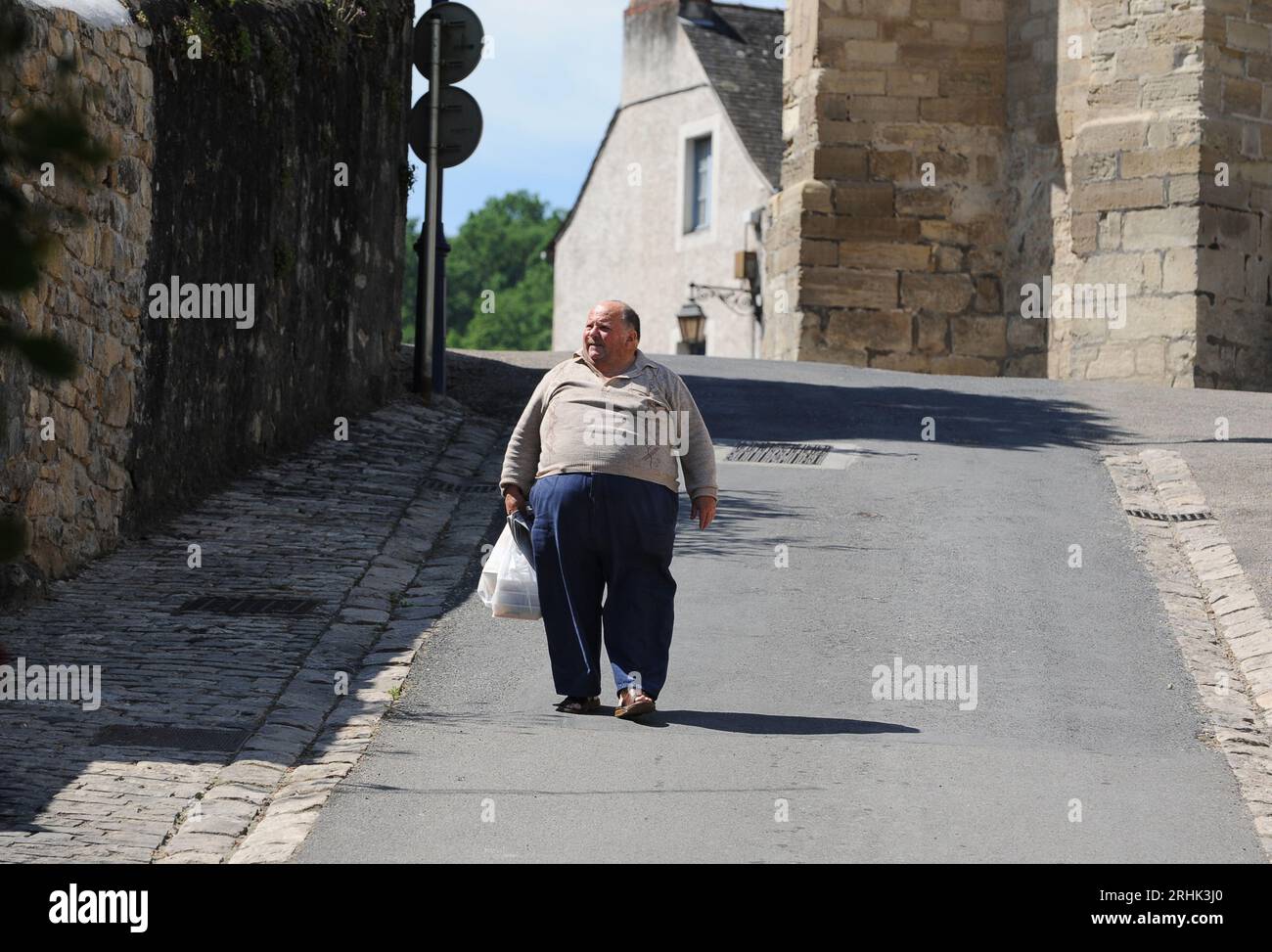 Fat man walking hi-res stock photography and images - Alamy