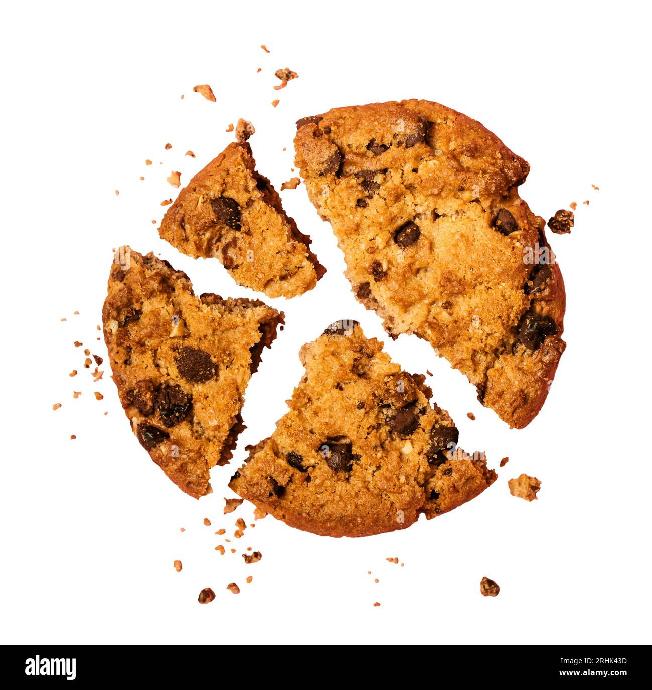 Broken chocolate chip cookie and crumbs cut out on white background ...