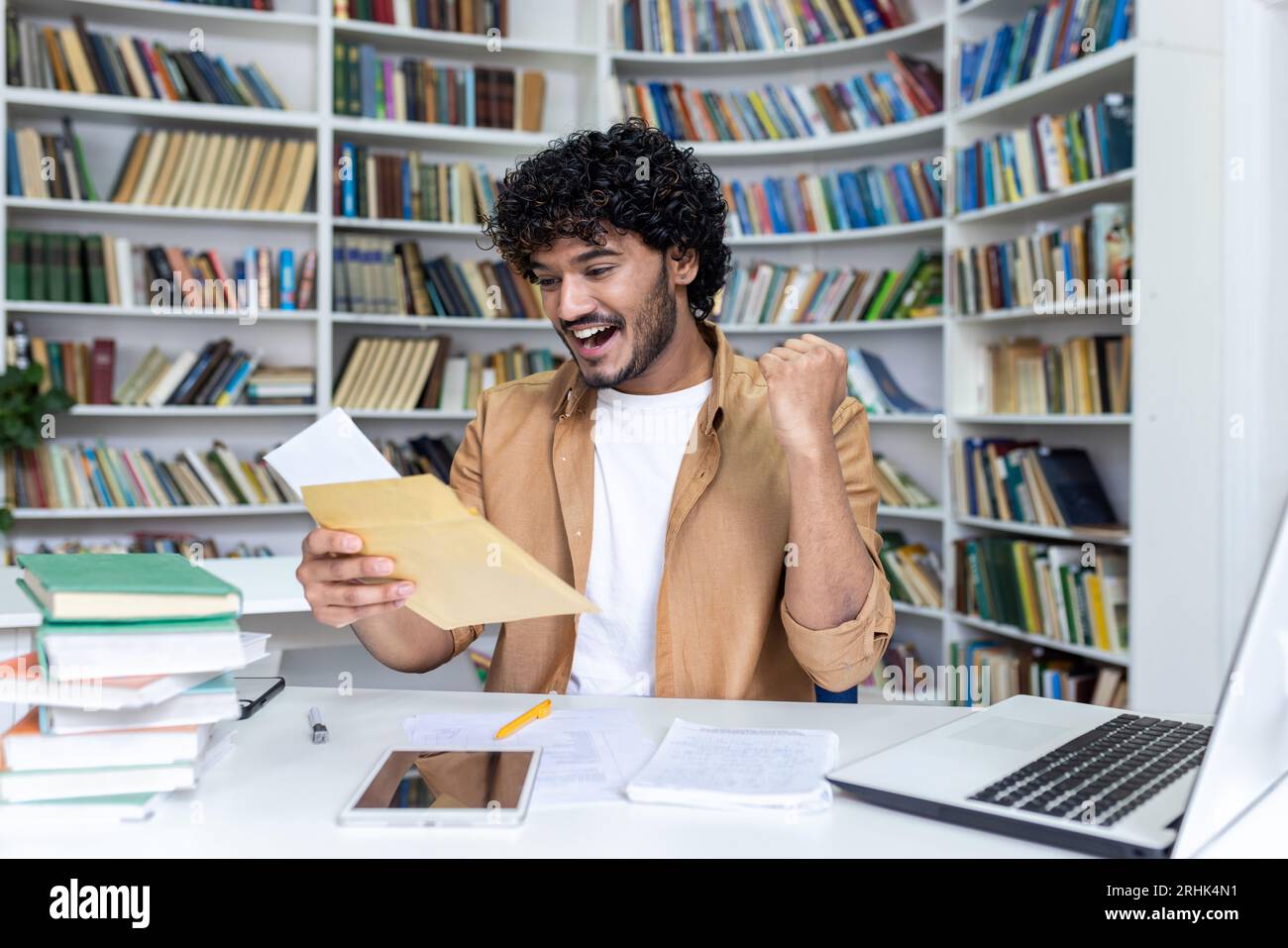 Young student received letter with good exam results and university ...