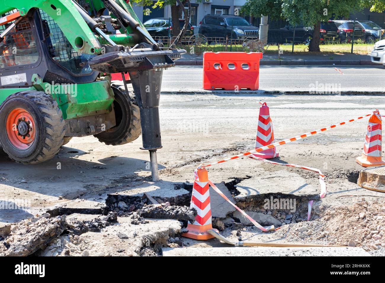 A manoeuvrable construction vehicle with an attached jackhammer ...