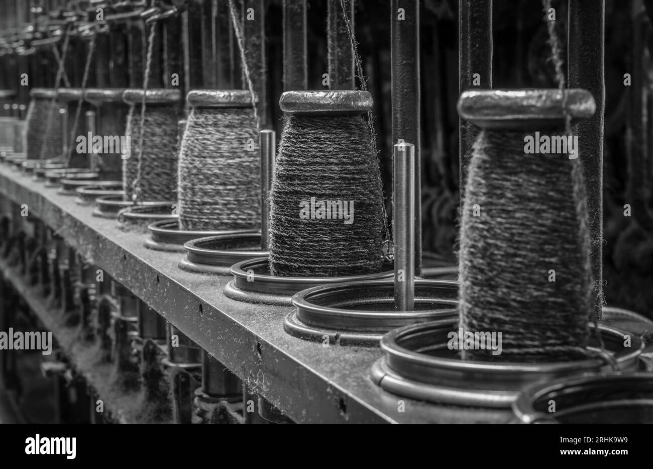 string spools of a historic weaving machine Stock Photo - Alamy
