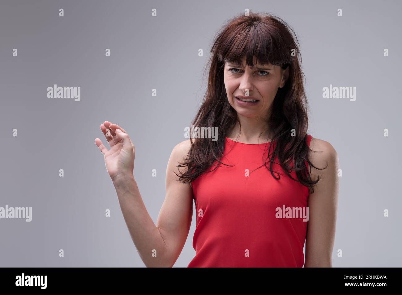 Her face unmistakably shows extreme discomfort and fear. Bad news has ...