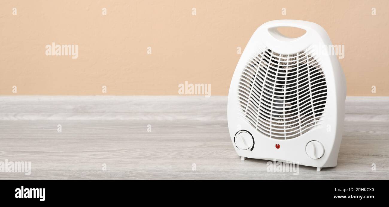 Electric fan near beige wall. Banner for design Stock Photo - Alamy